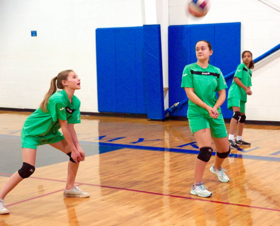 PE teaches teamwork and communication in volleyball